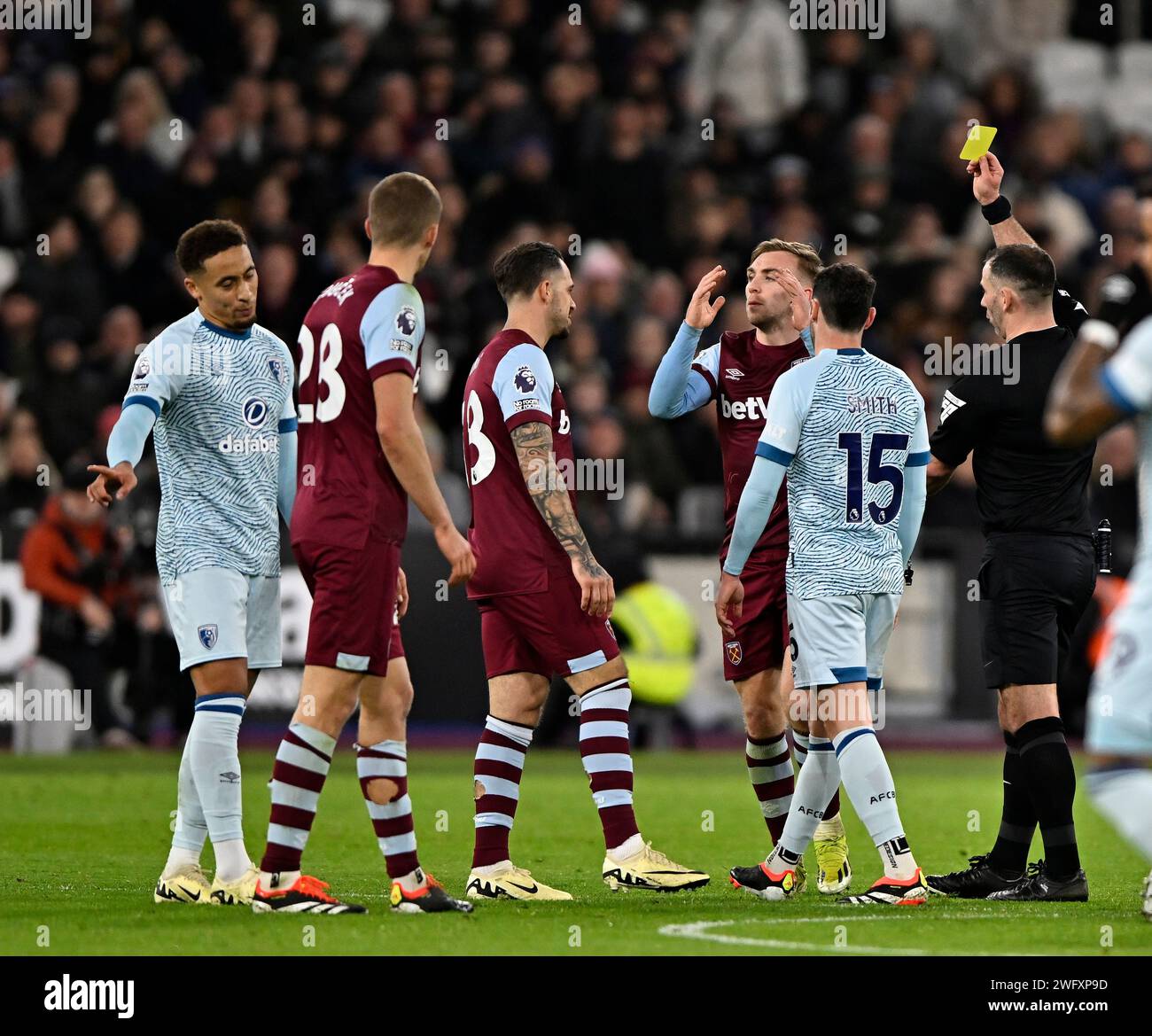 London, UK. 1st Feb, 2024. Tim Robinson (Referee) shows the yellow card ...