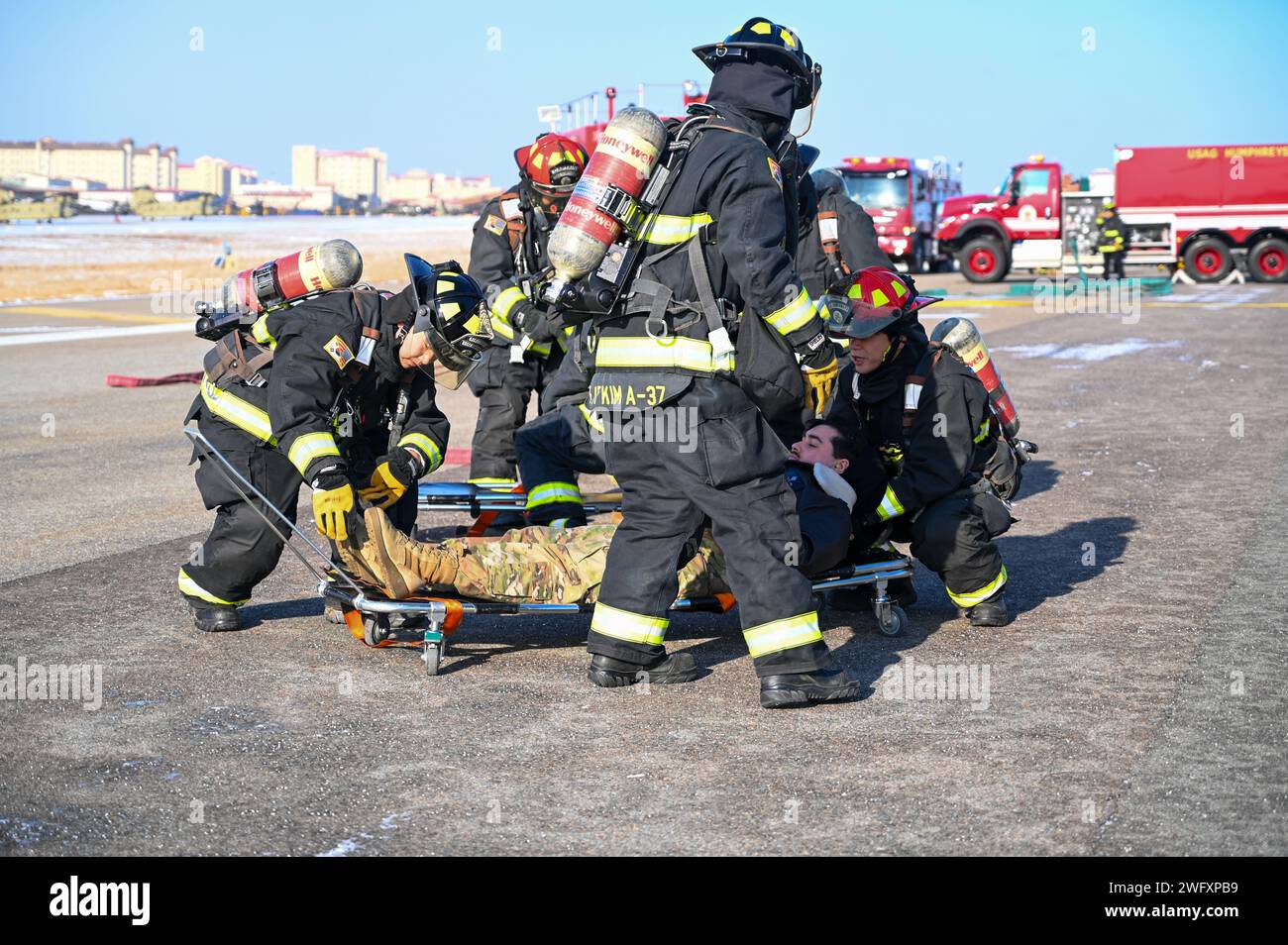 First responders treat a mock victim during a pre-accident drill on ...