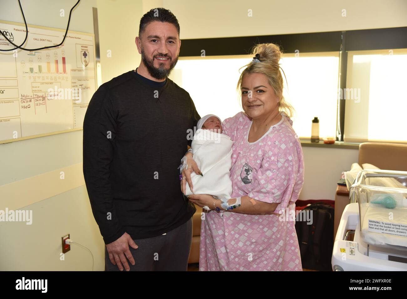 Hector and Angelina Navarro pose with their son Azarias, the first baby ...