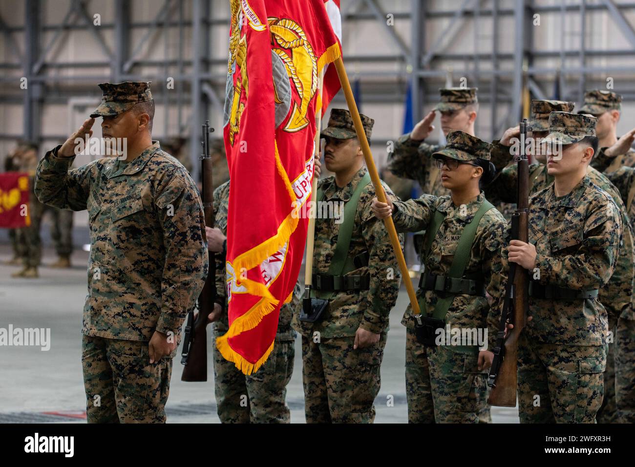 U.S. Marine Corps Lt. Col. Robert Stevenson III, left, renders a salute ...
