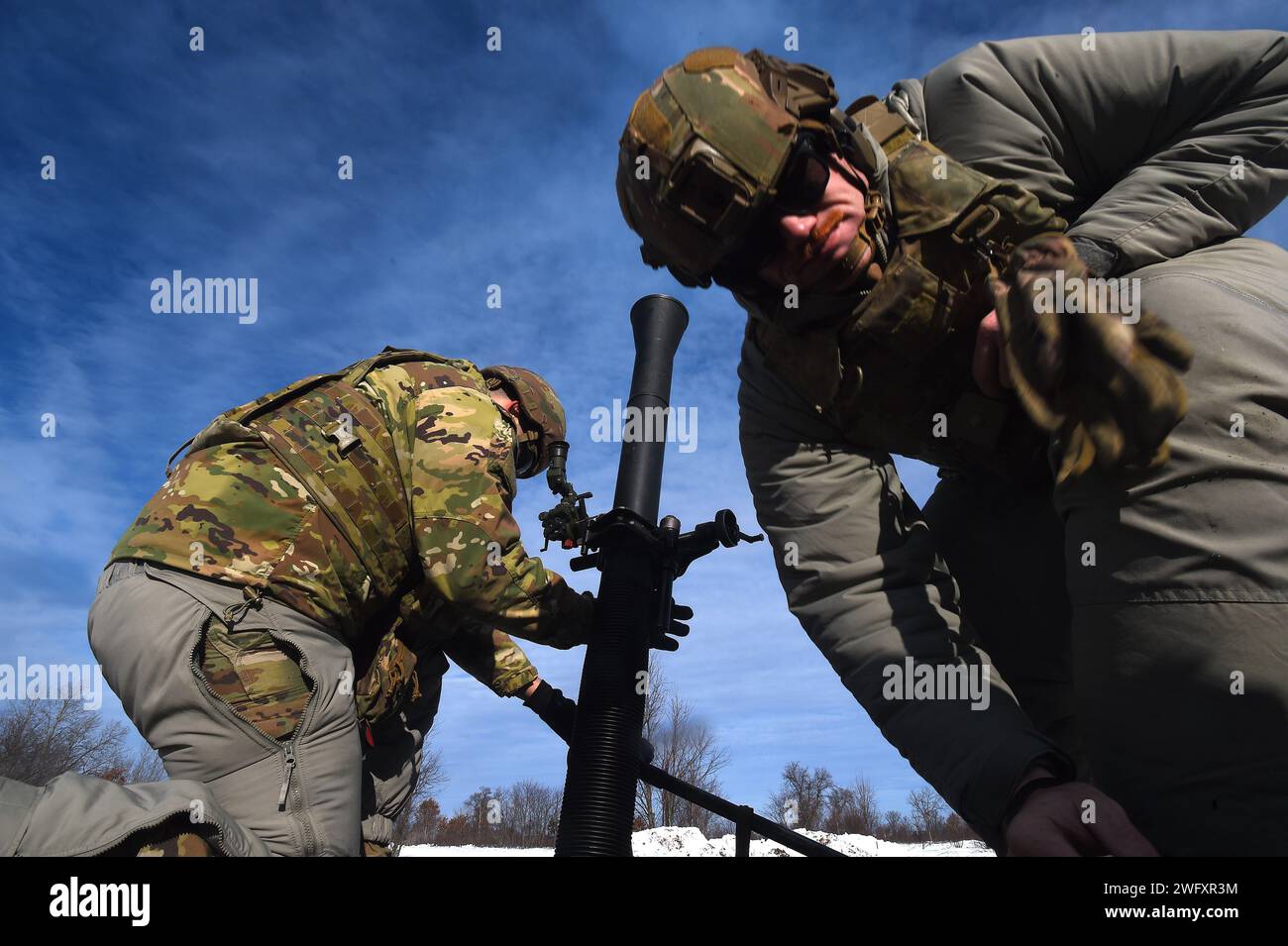Spc. Ryan Brust, right, and Spc. Emilio Bailey, both indirect fire ...