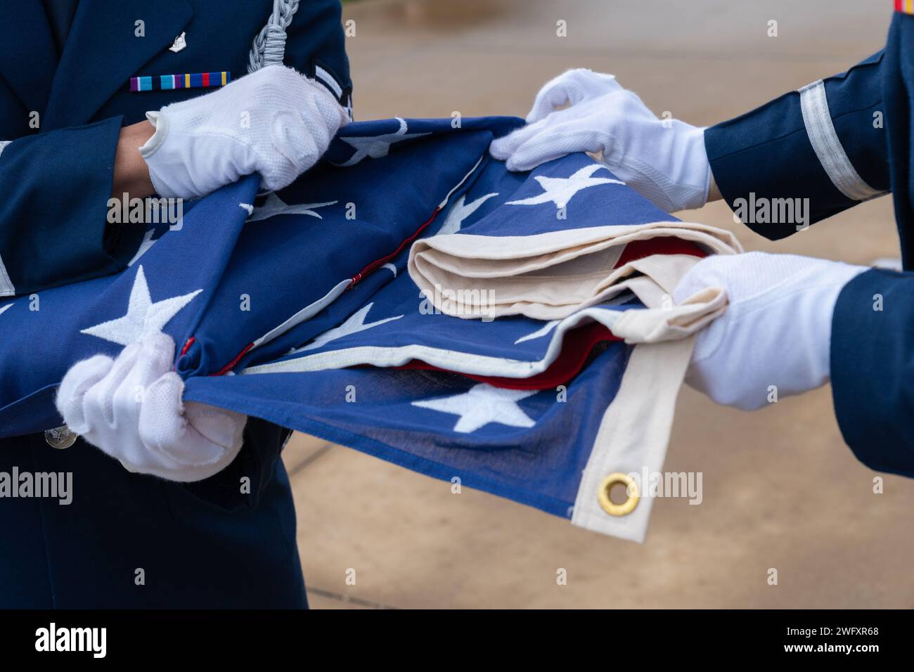Airmen assigned to the MacDill Air Force Base Honor Guard fold the ...