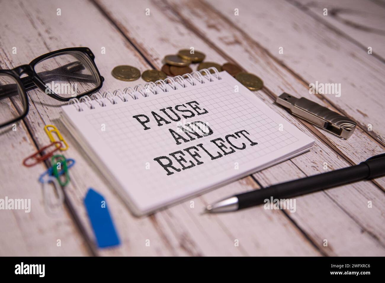 Blackboard written pause reflect with alarm clock. Pause and reflect ...