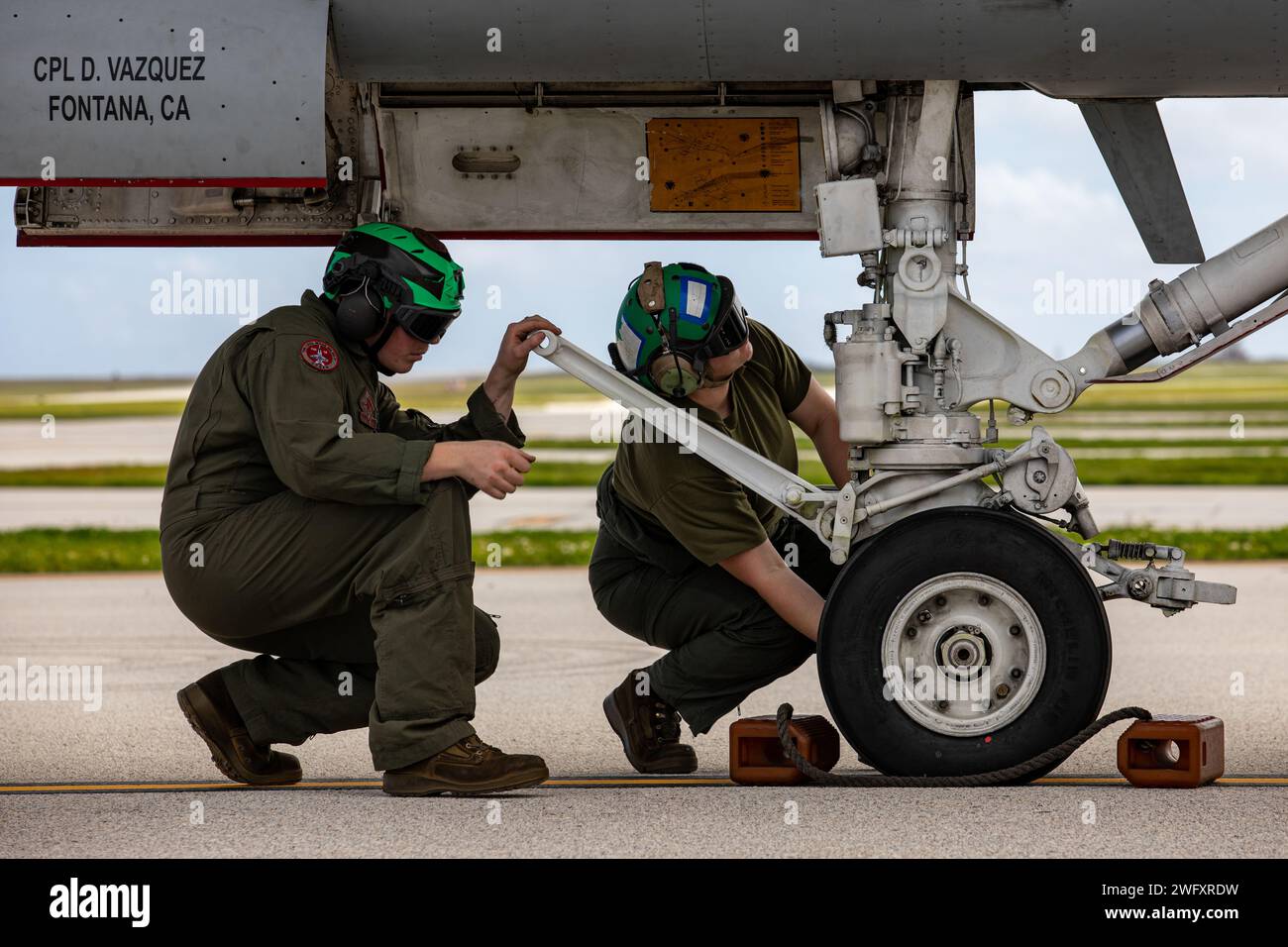 U.S. Marine Corps Cpl. Justin Solberg, left, a fixed-wing aircraft ...