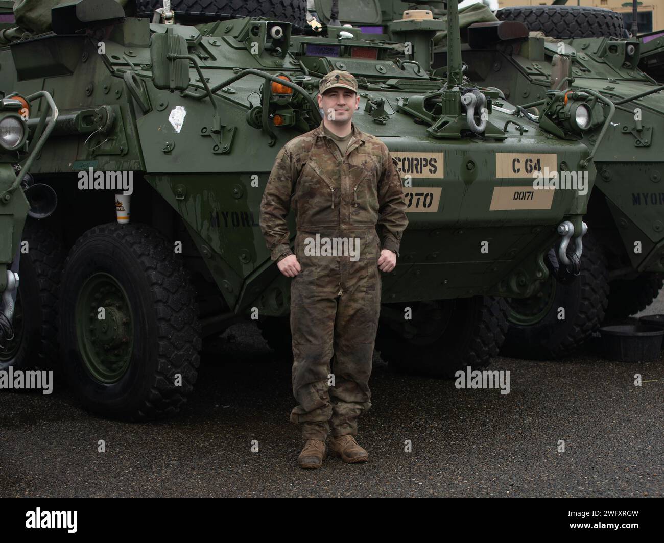 Spc. Justin Oosting, 91S Stryker Mechanic assigned to I Corps, conducts daily maintenance on the ...