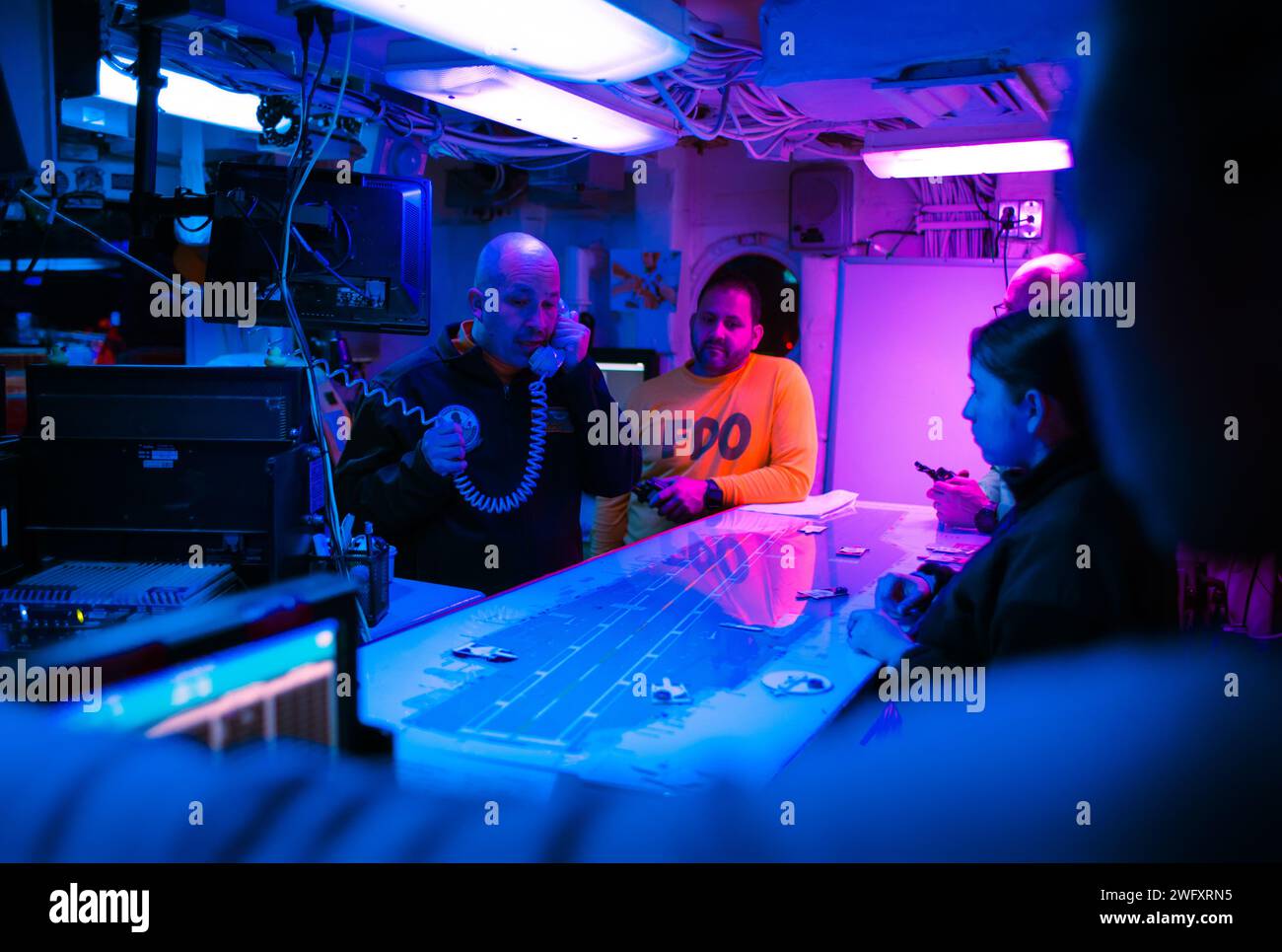 Sailors work the ouija board in flight deck control during nighttime ...