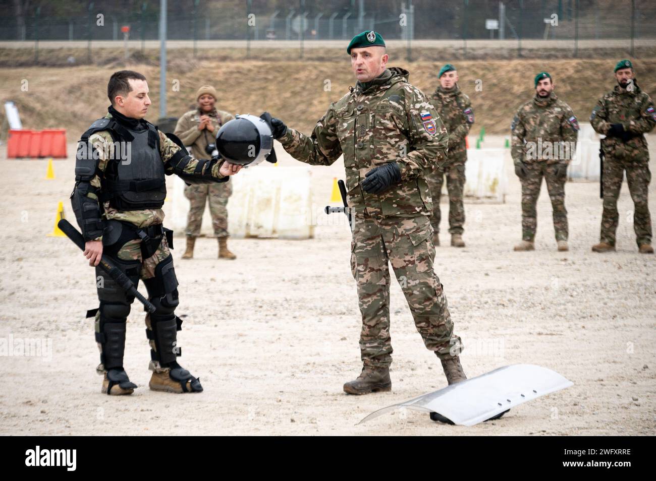 A Slovenian soldier, assigned to the Slovenian Armed Forces, instructs ...