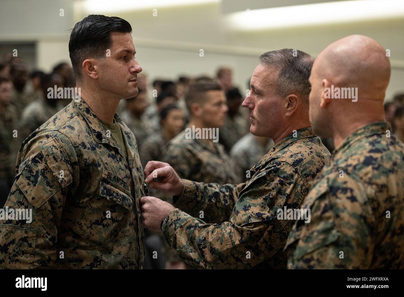 U.S. Marines Corps Lt. Col. Andrew Nicholson presents a Navy and Marine ...