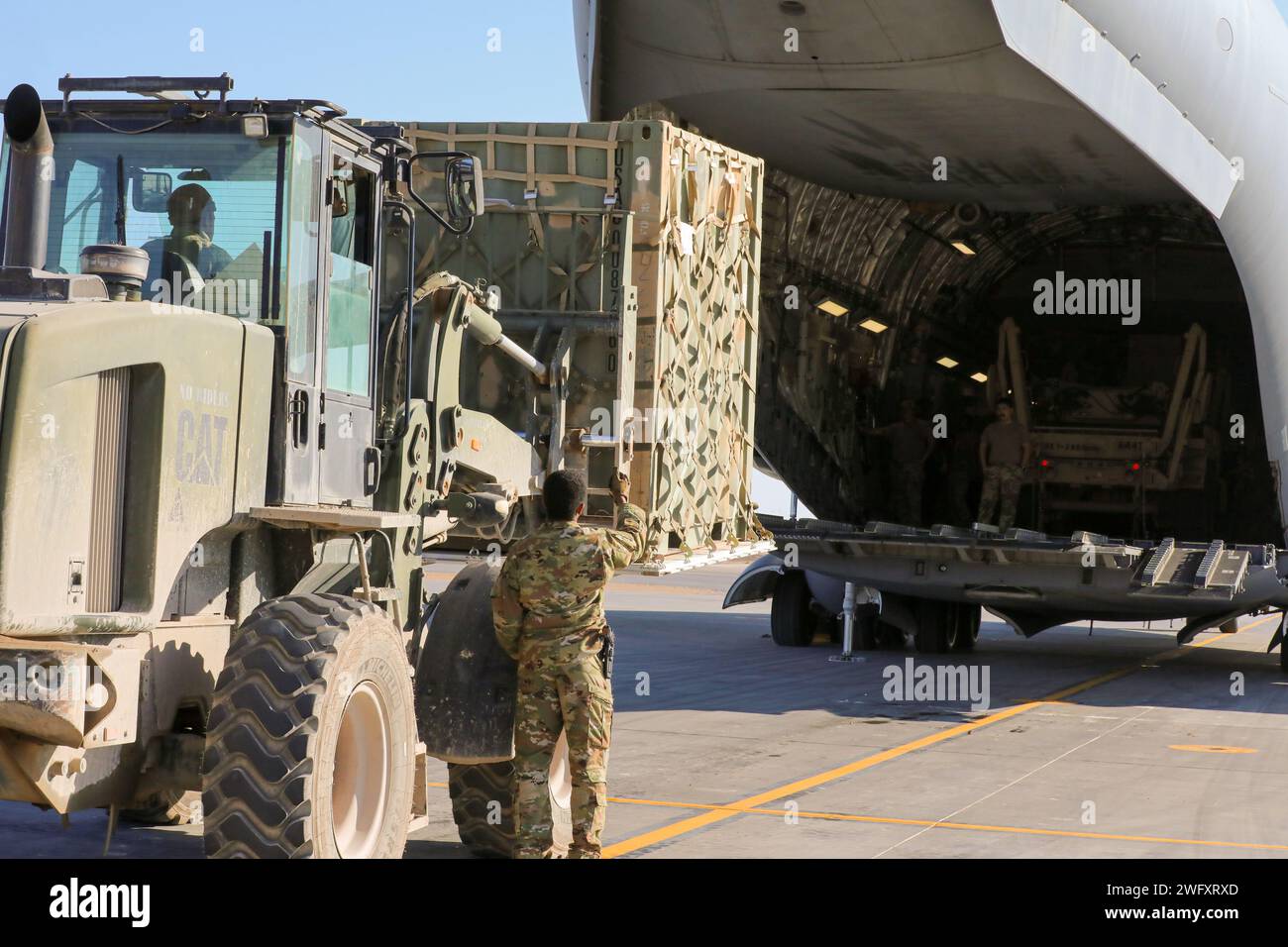 U.S. Air Force Airmen assigned to the 21st Expeditionary Airlift ...