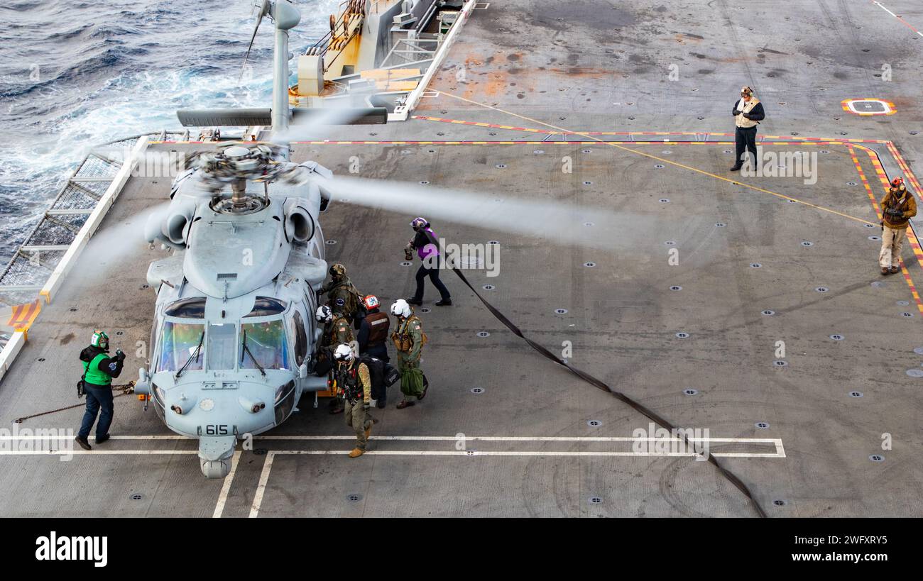 Sailors assigned to Helicopter Sea Combat Squadron (HSC-5) board an MH ...