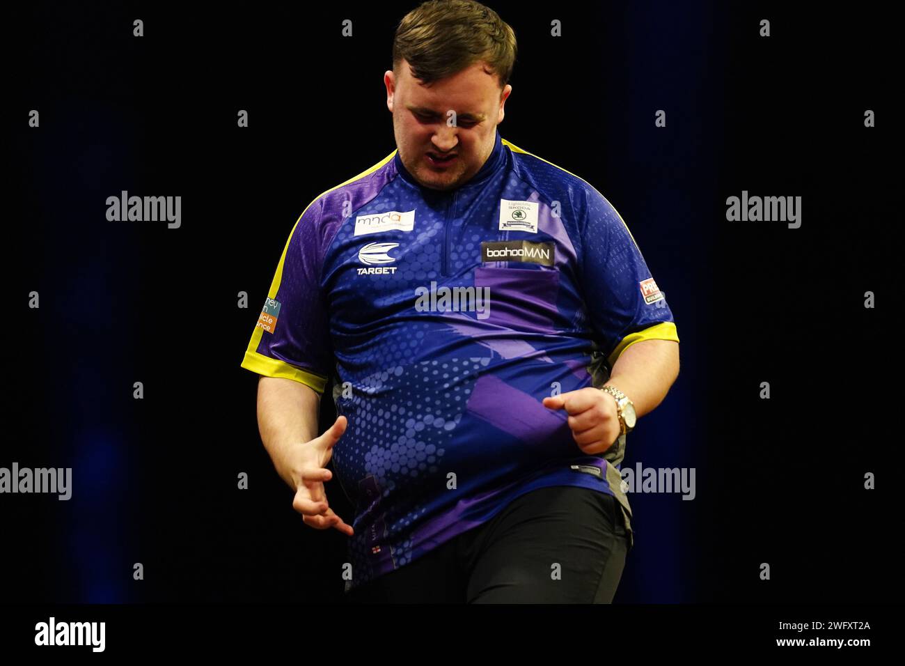 Luke Littler reacts on his way to losing his match against Michael ...