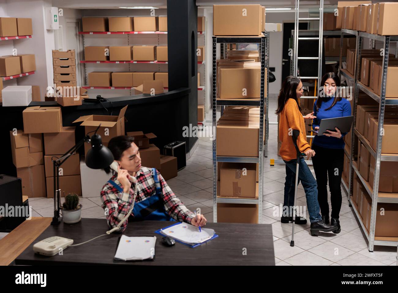 Retail storehouse asian employees hi-res stock photography and images ...