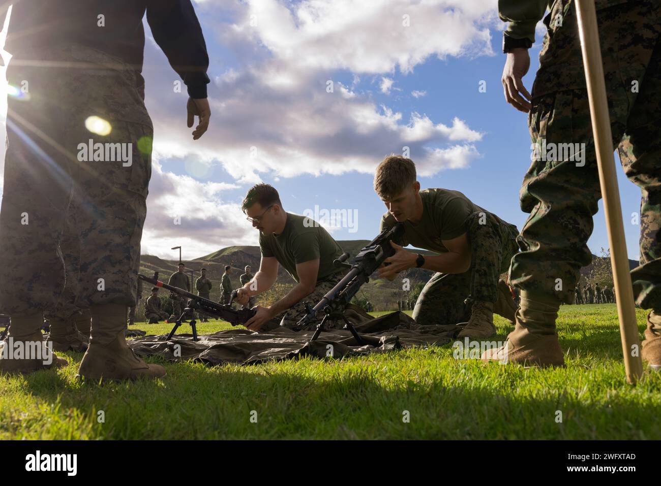 U.S. Marines with 11th Marine Regiment, 1st Marine Division, assemble M240B medium machine guns ...