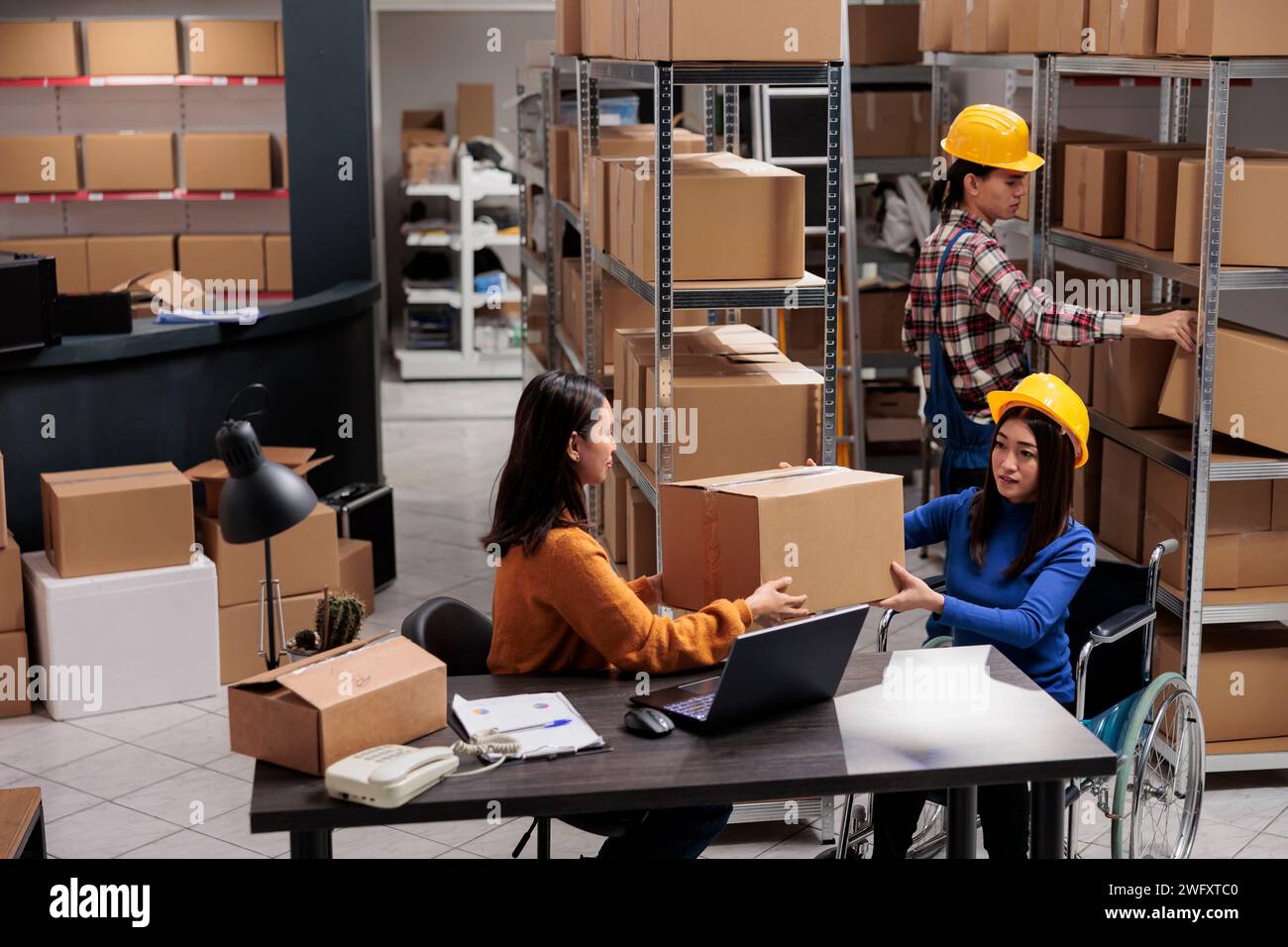 Shipment employees managing distribution in disability inclusive ...