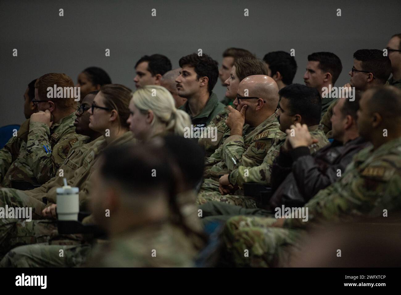 U.S. Air Force Airmen listen to the 23rd Wing command team speak at an ...