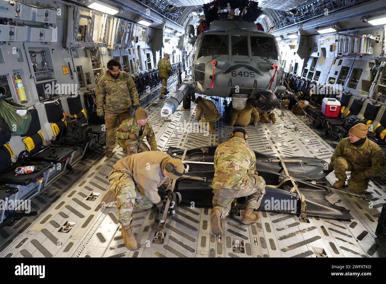 Airmen from the 176th and 718th Aircraft Maintenance Squadrons secure ...