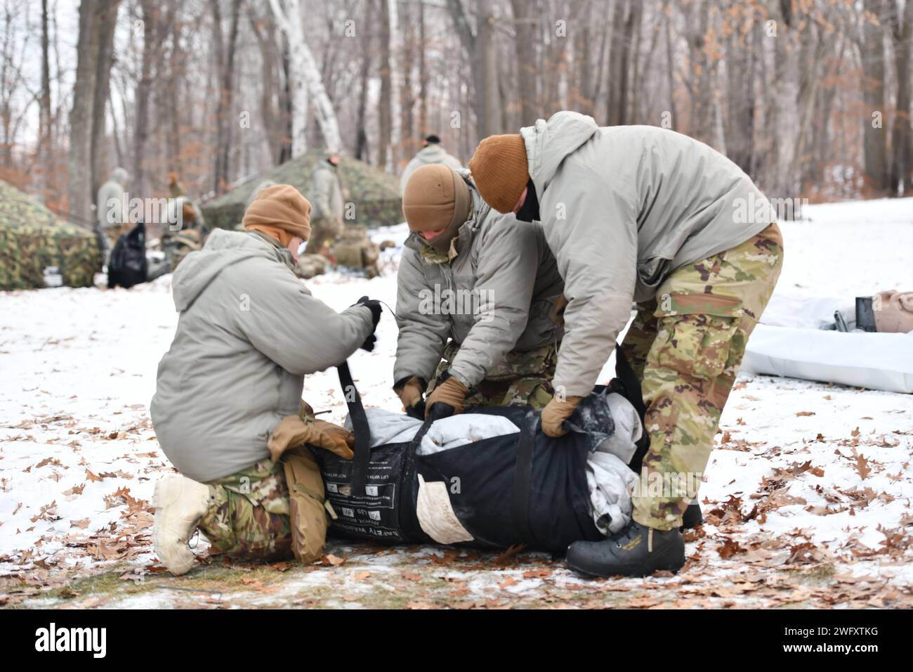 Air National Guard Security Forces specialists pack their artic tent ...