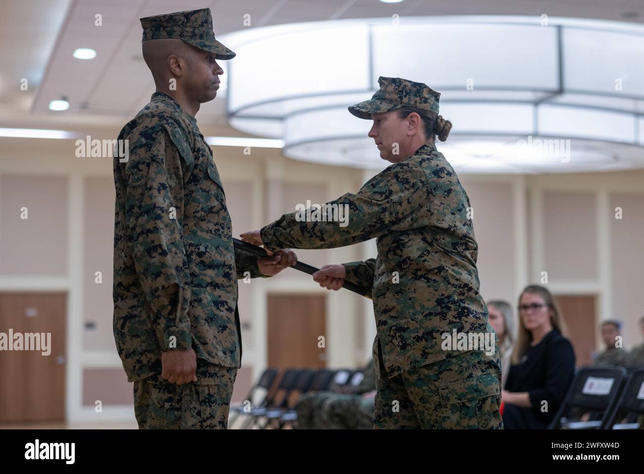 U.S. Marine Corps Sgt. Maj. Paris Mintz, left, incoming sergeant major ...