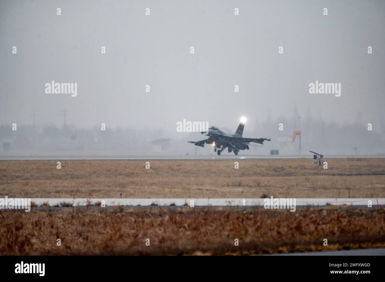 A U.S. Air Force F-16 Fighting Falcon lands at Osan Air Base, Republic ...