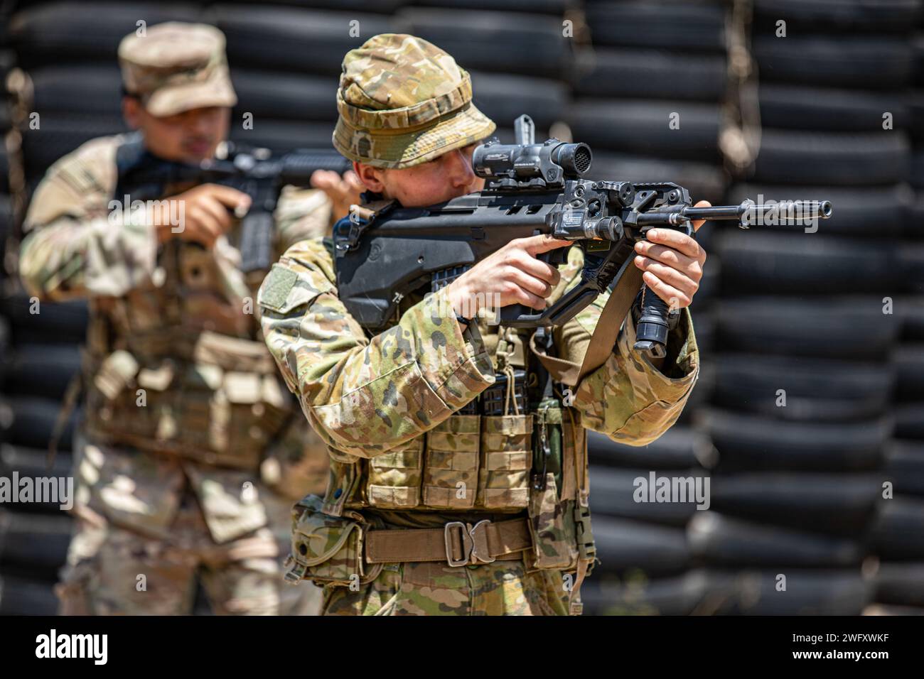 An Australian Soldier and a U.S. Army Soldier, assigned to the 25th ...
