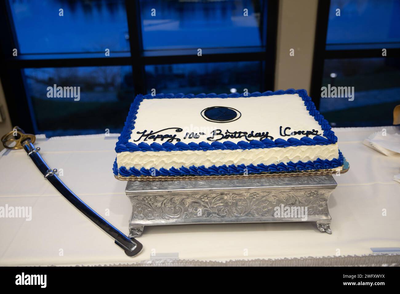 America’s First Corps’ birthday cake is proudly displayed on a stand at ...