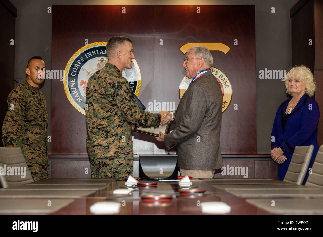 U.S. Marine Corps Brig. Gen. Jason Woodworth, center left, commanding ...