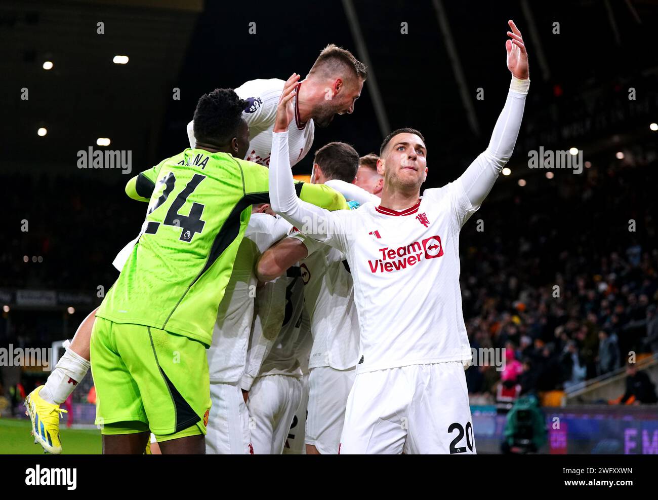 Manchester United's Diogo Dalot (right) celebrates after team-mate ...