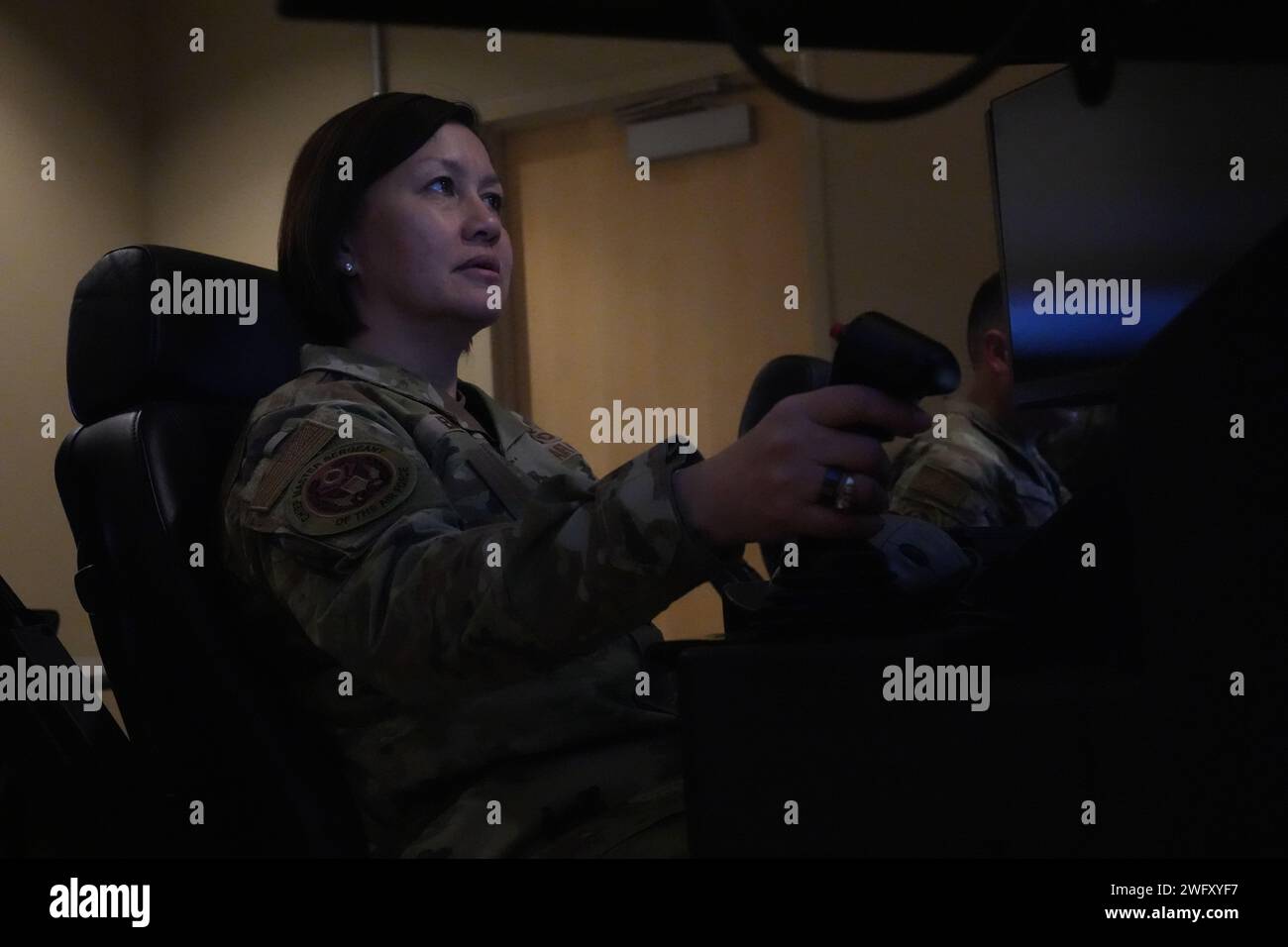 Chief Master Sergeant of the Air Force JoAnne S. Bass, sits in an MQ-9 ...
