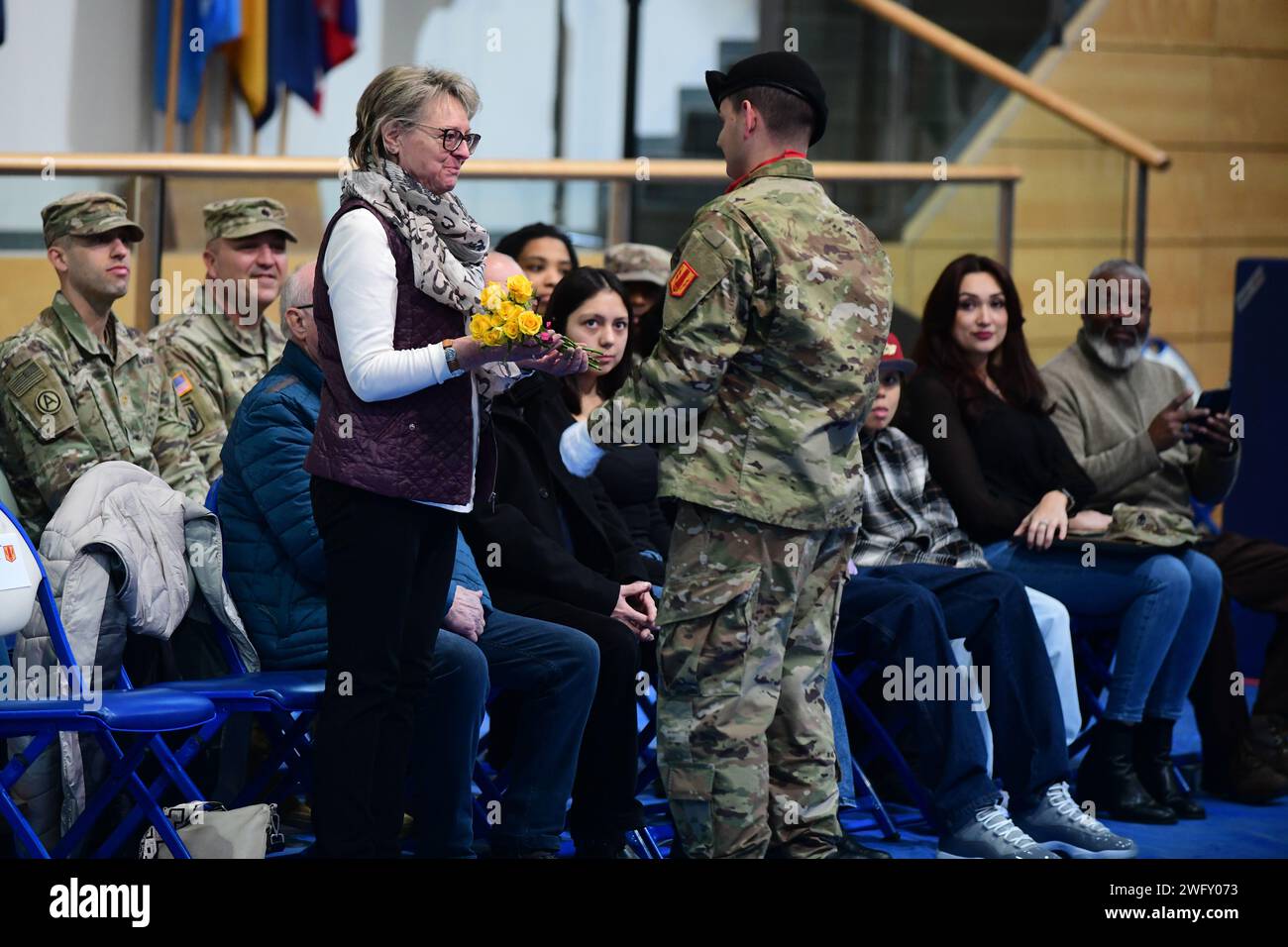 Distinguished guests receive flowers during the 1st battalion, 77th ...