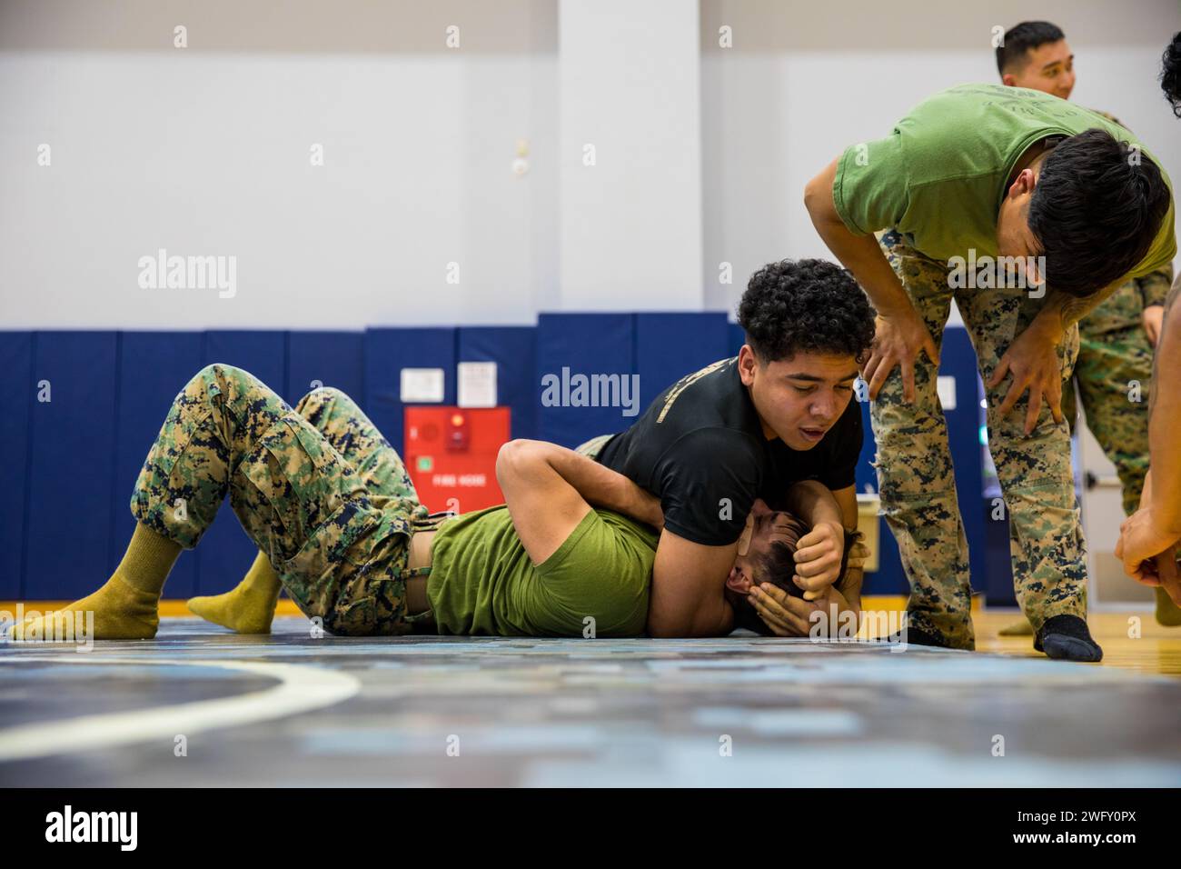 U.S. Marine Corps Cpl. Angelo Olszewski, top, an aviation logistics ...