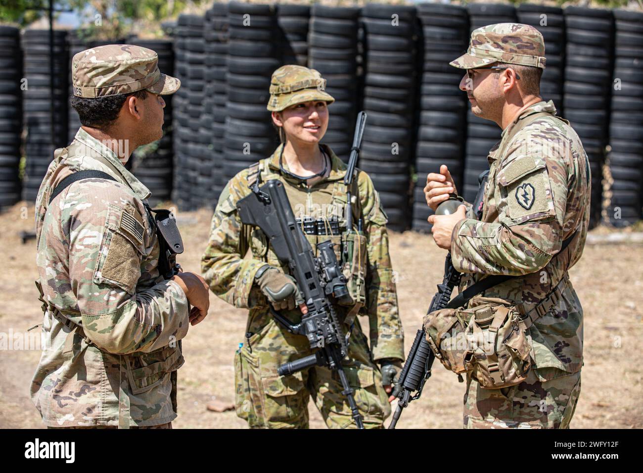 Two U.S. Army Soldiers, assigned to the 25th Infantry Division, talks ...