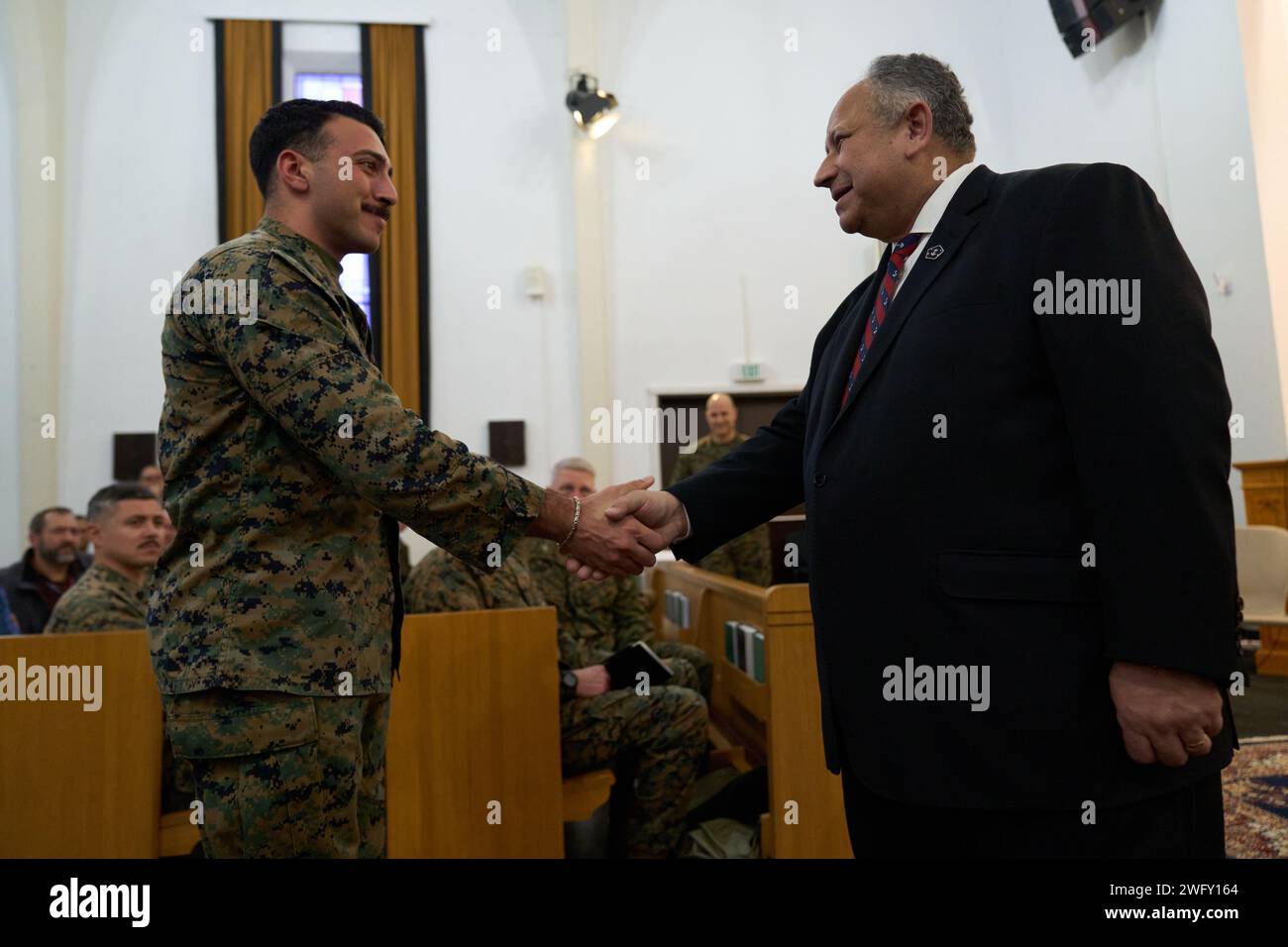 Secretary of the Navy Carlos Del Toro and Sgt. Ali Attabi, a Marine ...