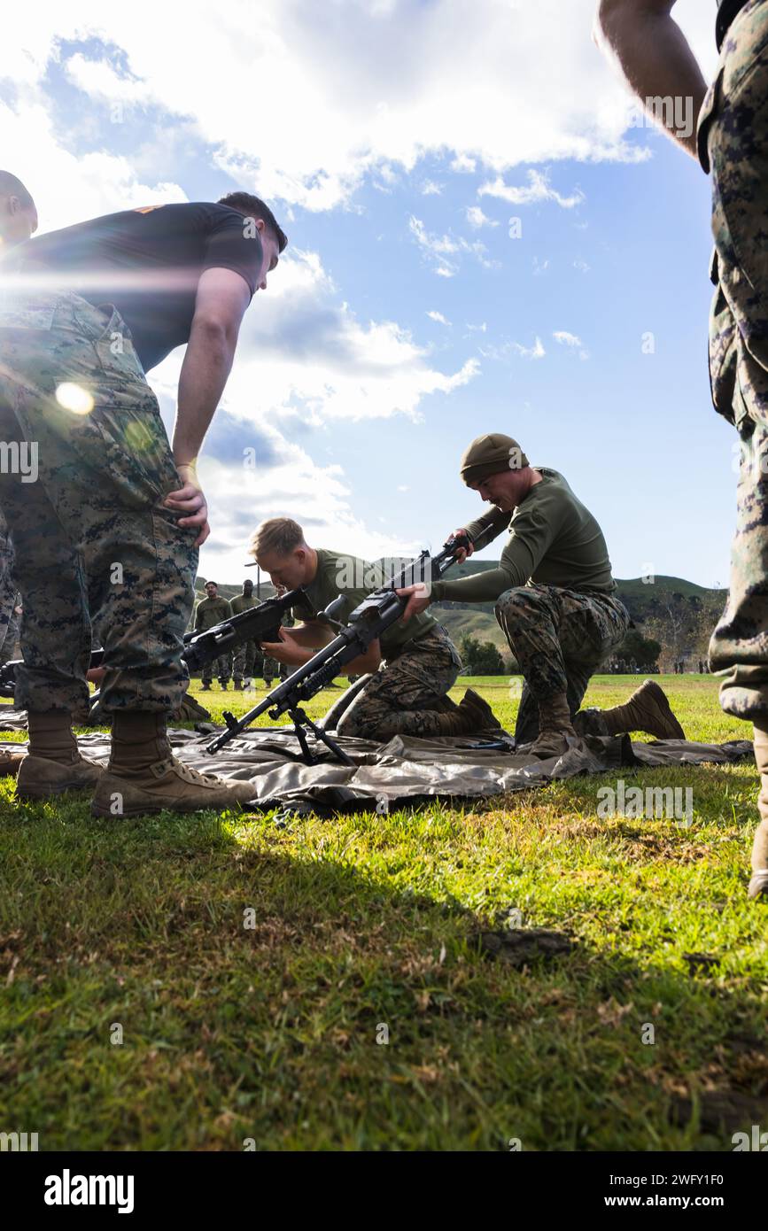 U.S. Marines with 11th Marine Regiment, 1st Marine Division, assemble M240B medium machine guns ...