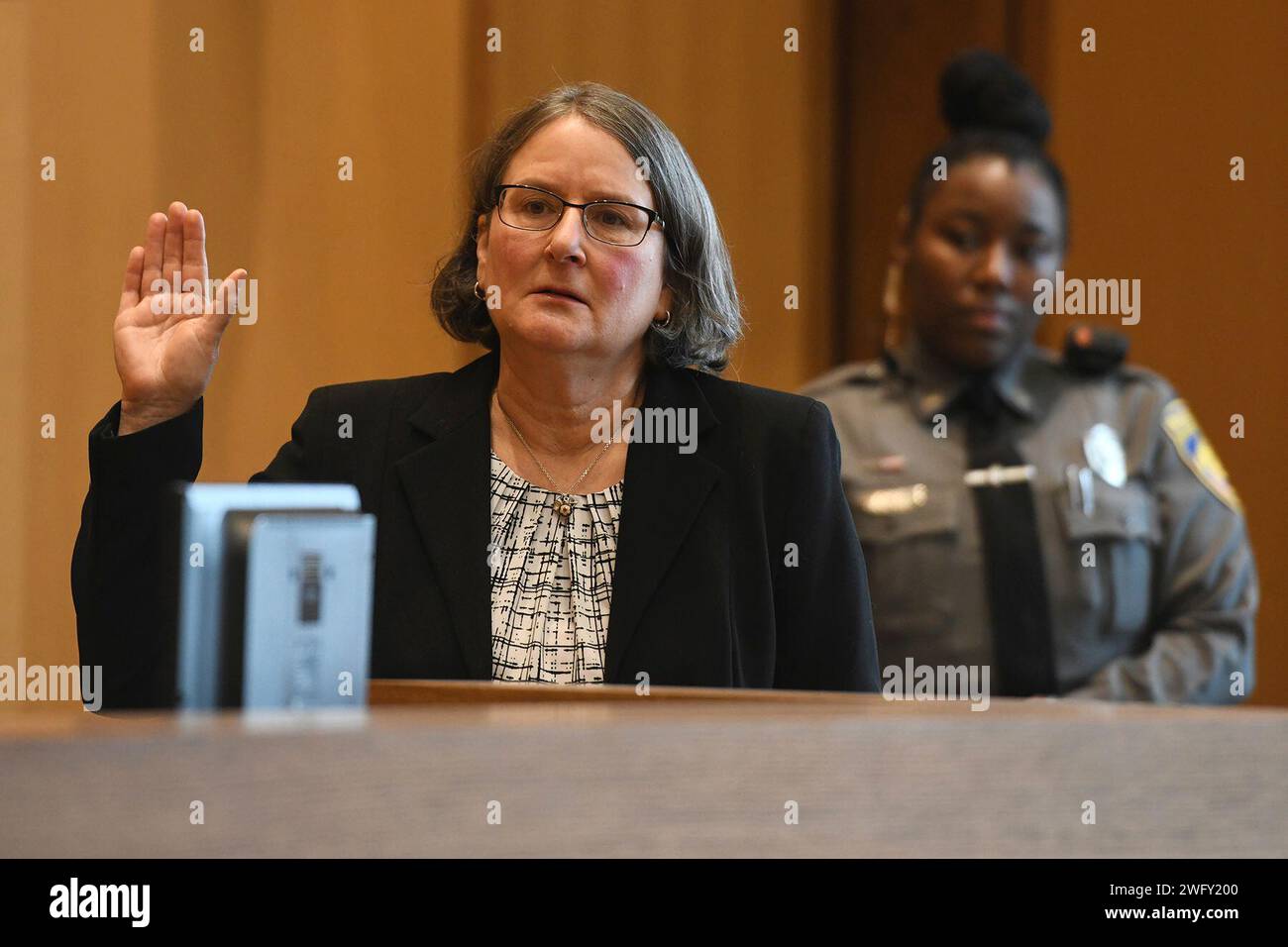Christine Roy, state forensic science examiner, is sworn before ...