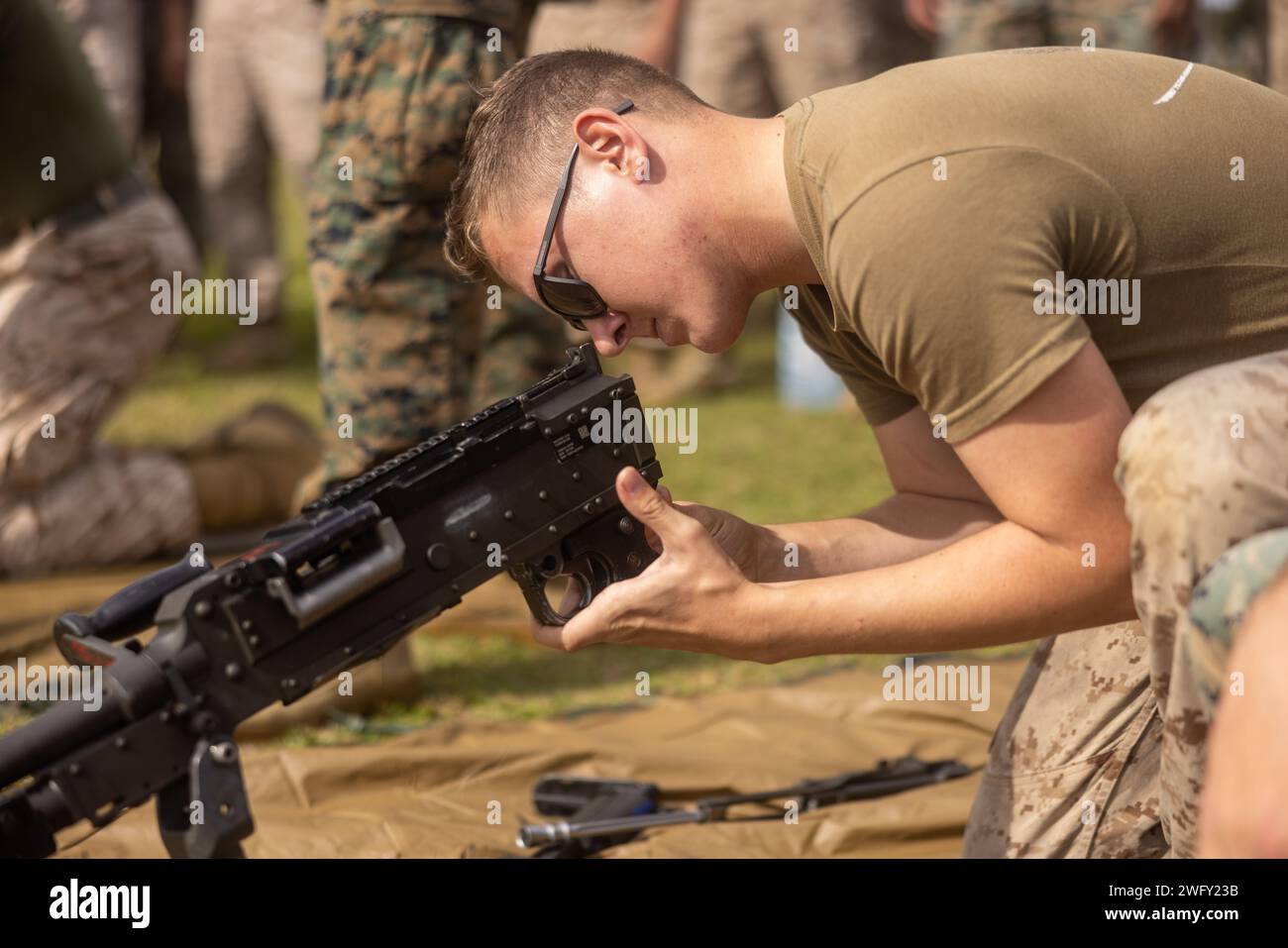 U.S. Marines with Marine Air Support Squadron (MASS) 2 participate in a M240 Bravo machine gun ...
