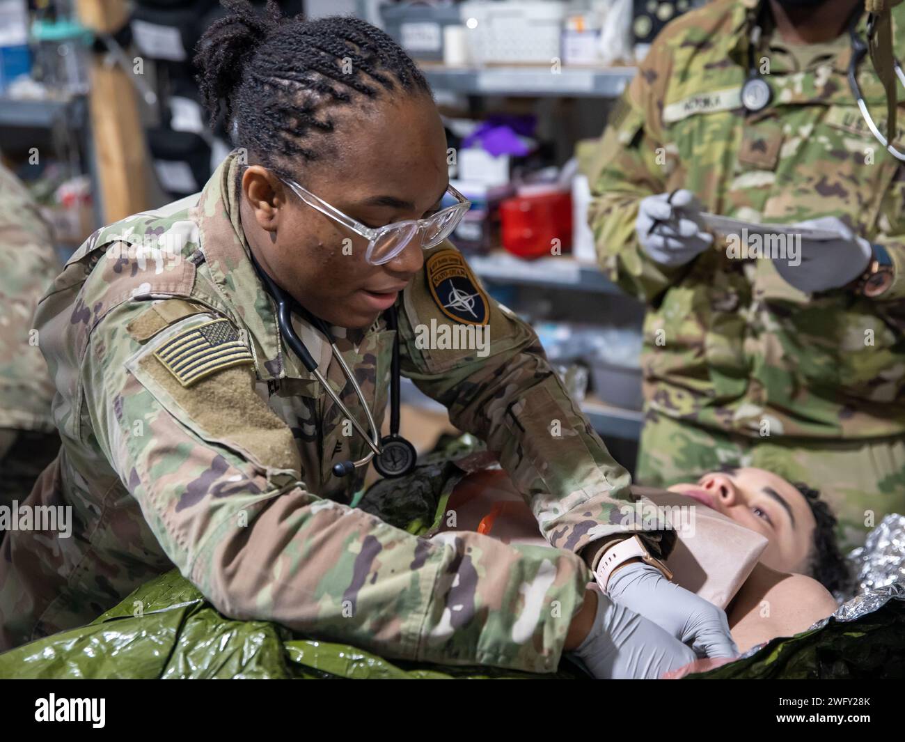 U.S. Army Sgt. Marie Noel, a combat medic attached to Headquarters and ...