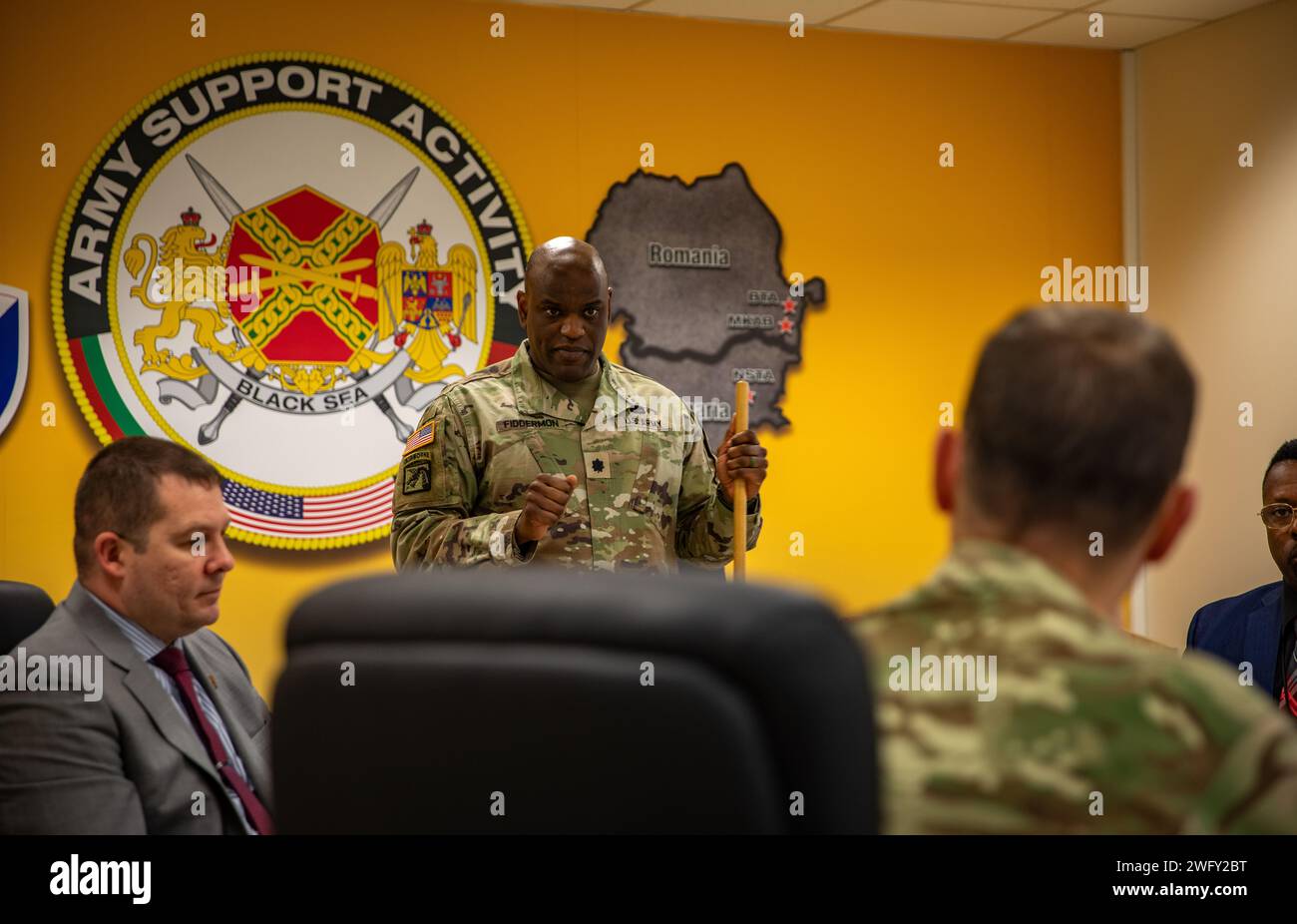 Lt. Col. Brian C. Fiddermon (left), commander of the Army Support Activity-Black Sea briefs Maj ...