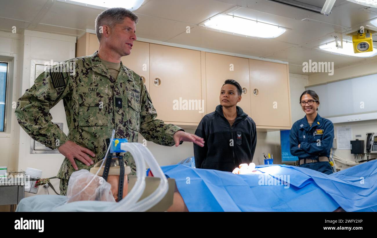 Rear Adm. Bill Daly (left), commander, Carrier Strike Group 15, speaks ...
