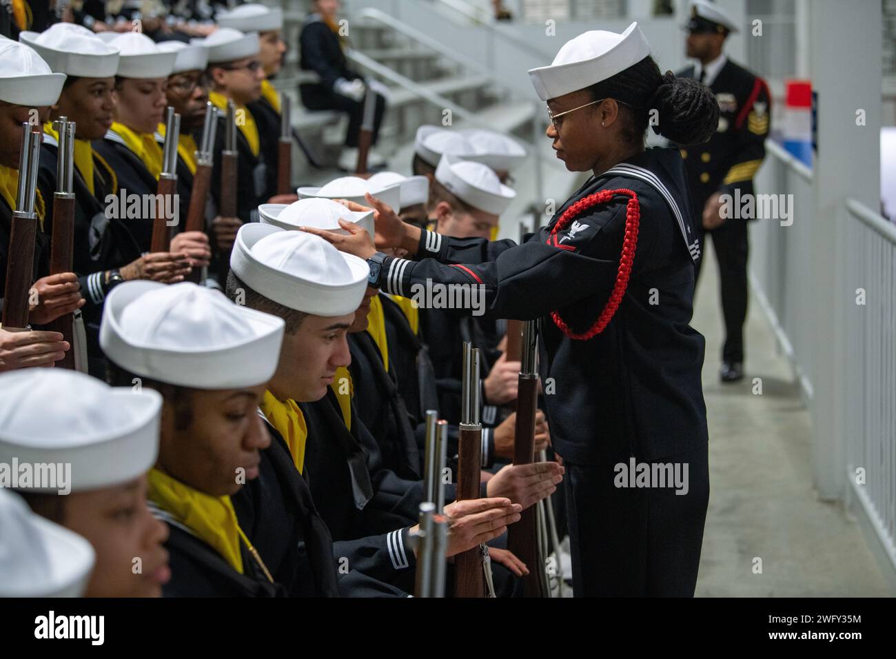 Hospital Corpsman 2nd Class Ashley Thornton adjusts a Recruit's cover ...