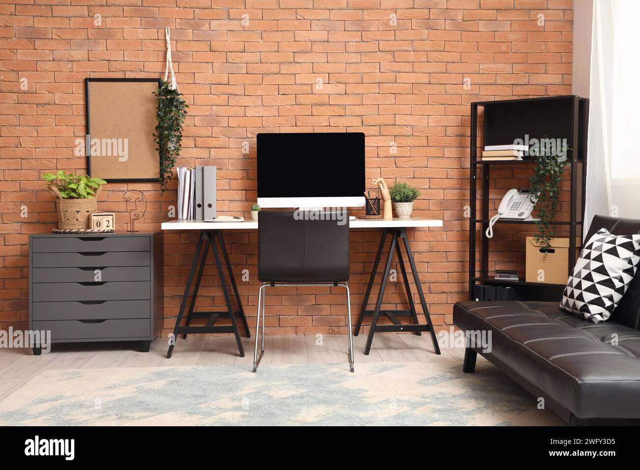 Interior of modern office with workplace, shelf unit and drawers Stock ...