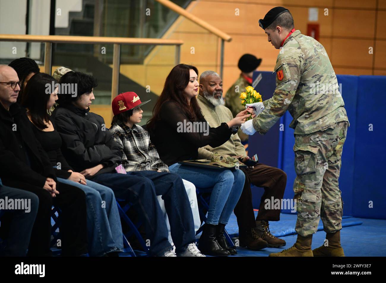 Distinguished guests receive flowers during the 1st battalion, 77th ...