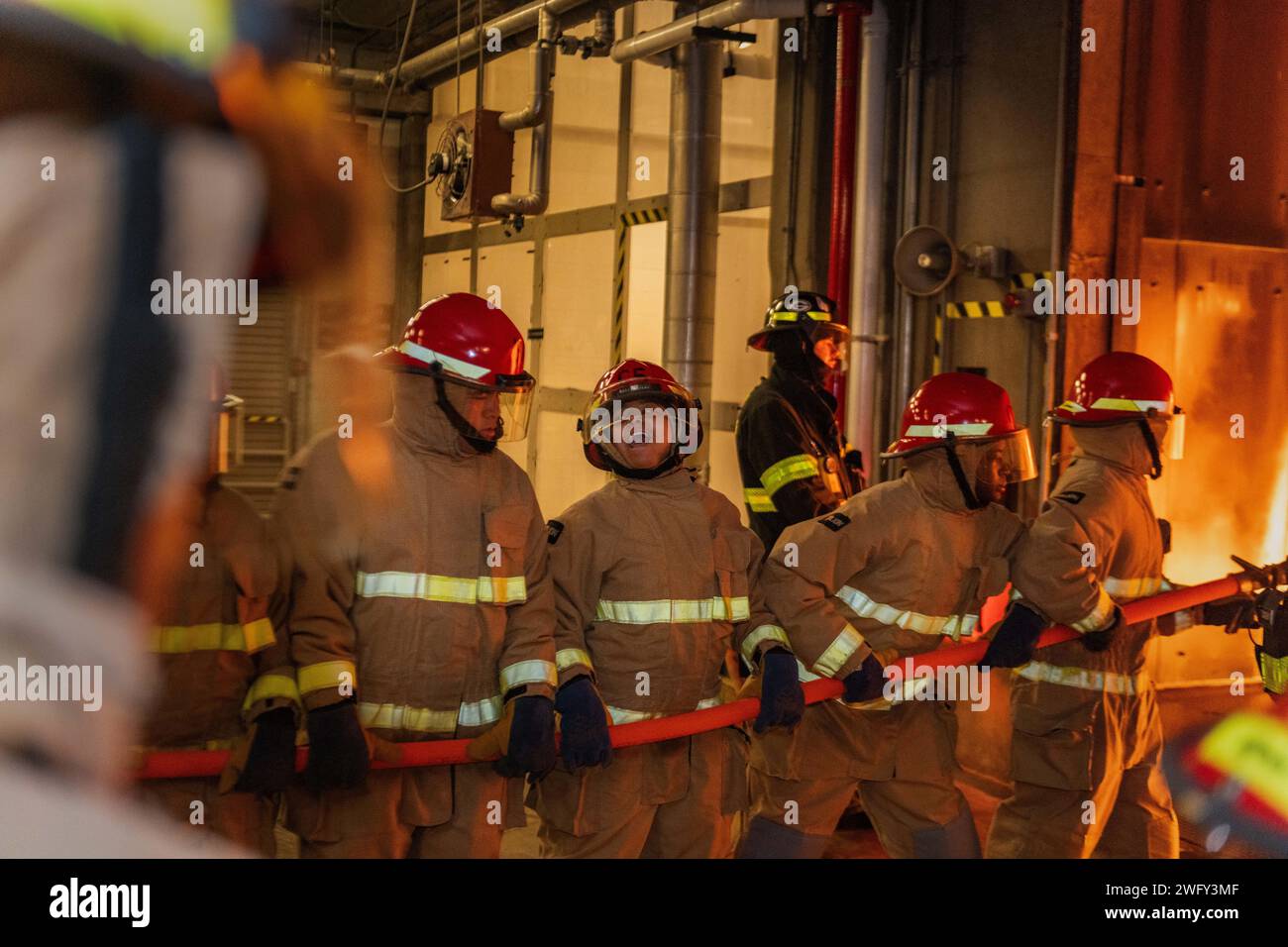 GREAT LAKES, Il. (Jan. 10, 2024) New-accession Sailors man a firehose ...