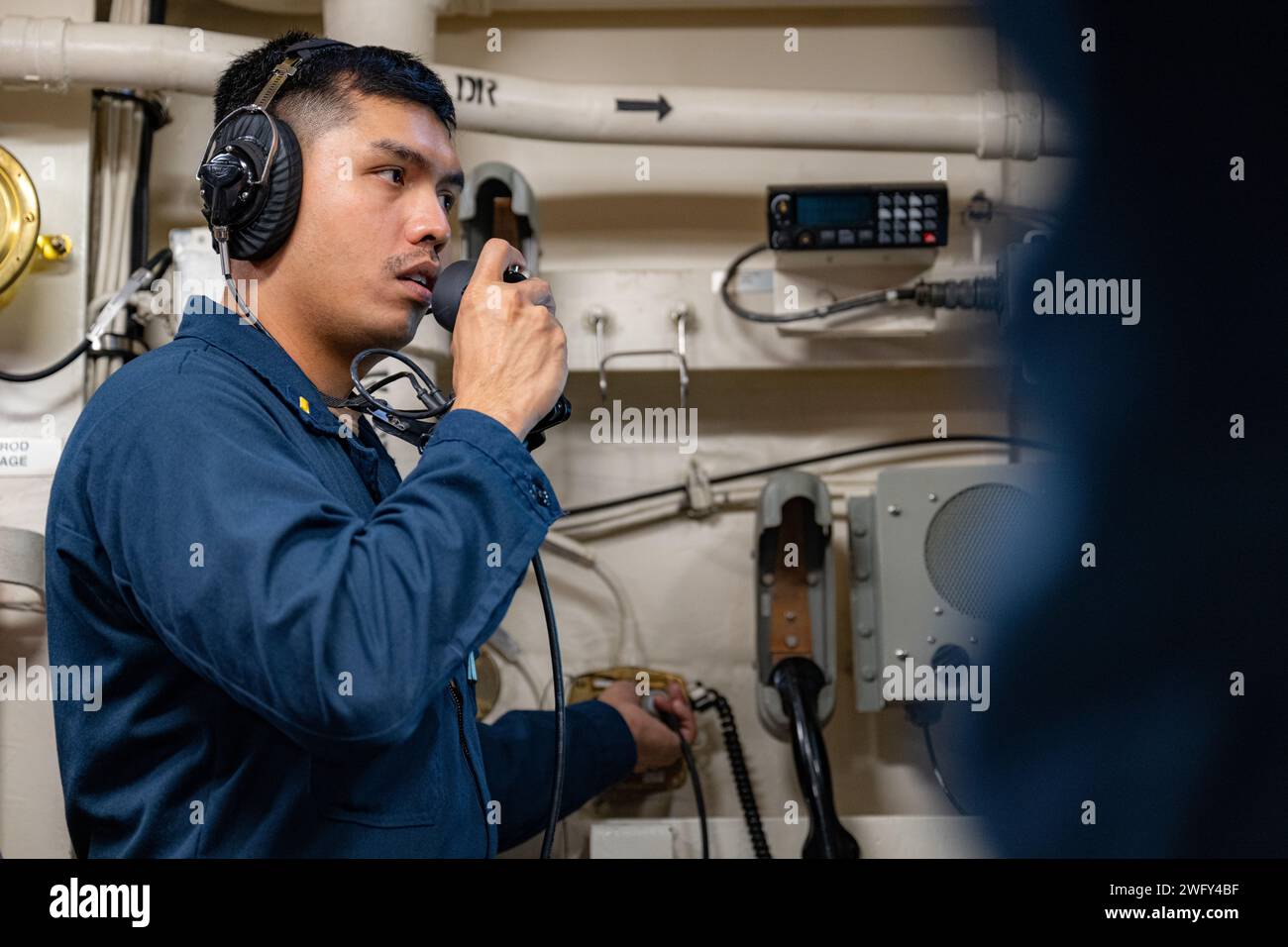 Ensign Joseph Musngi, a native of Pampanga, Philippines, operates a ...
