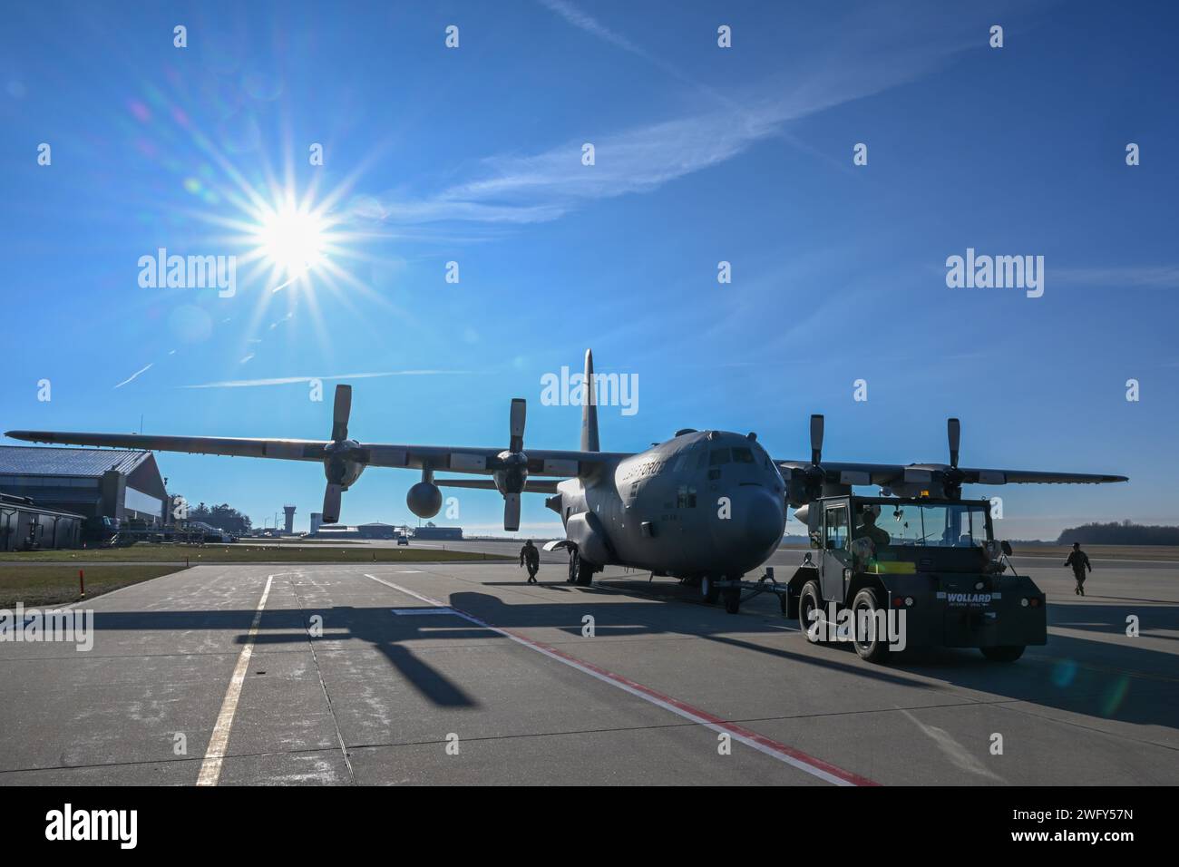 Members of the 910th Maintenance Group taxi an aircraft from a ...