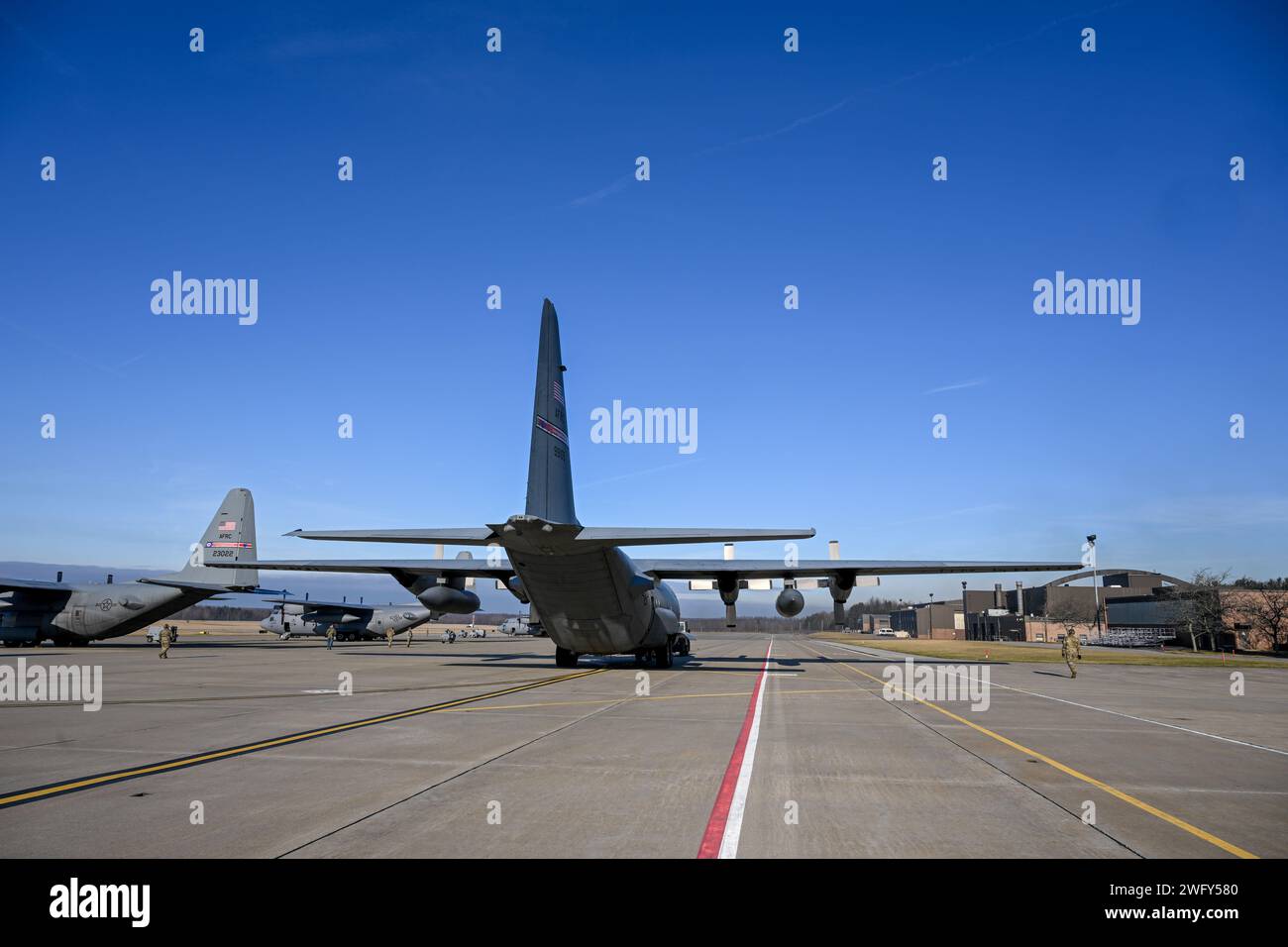 Members of the 910th Maintenance Group taxi an aircraft from a ...