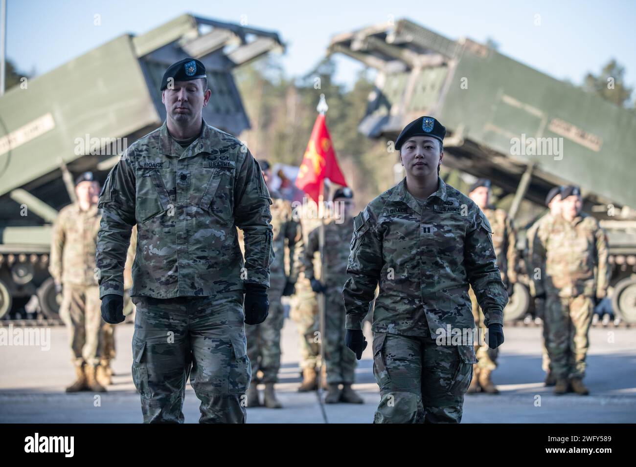 U.S. Army Lt. Col. Ben Roark and Cpt. Phuong Quach uncase the Charlie ...