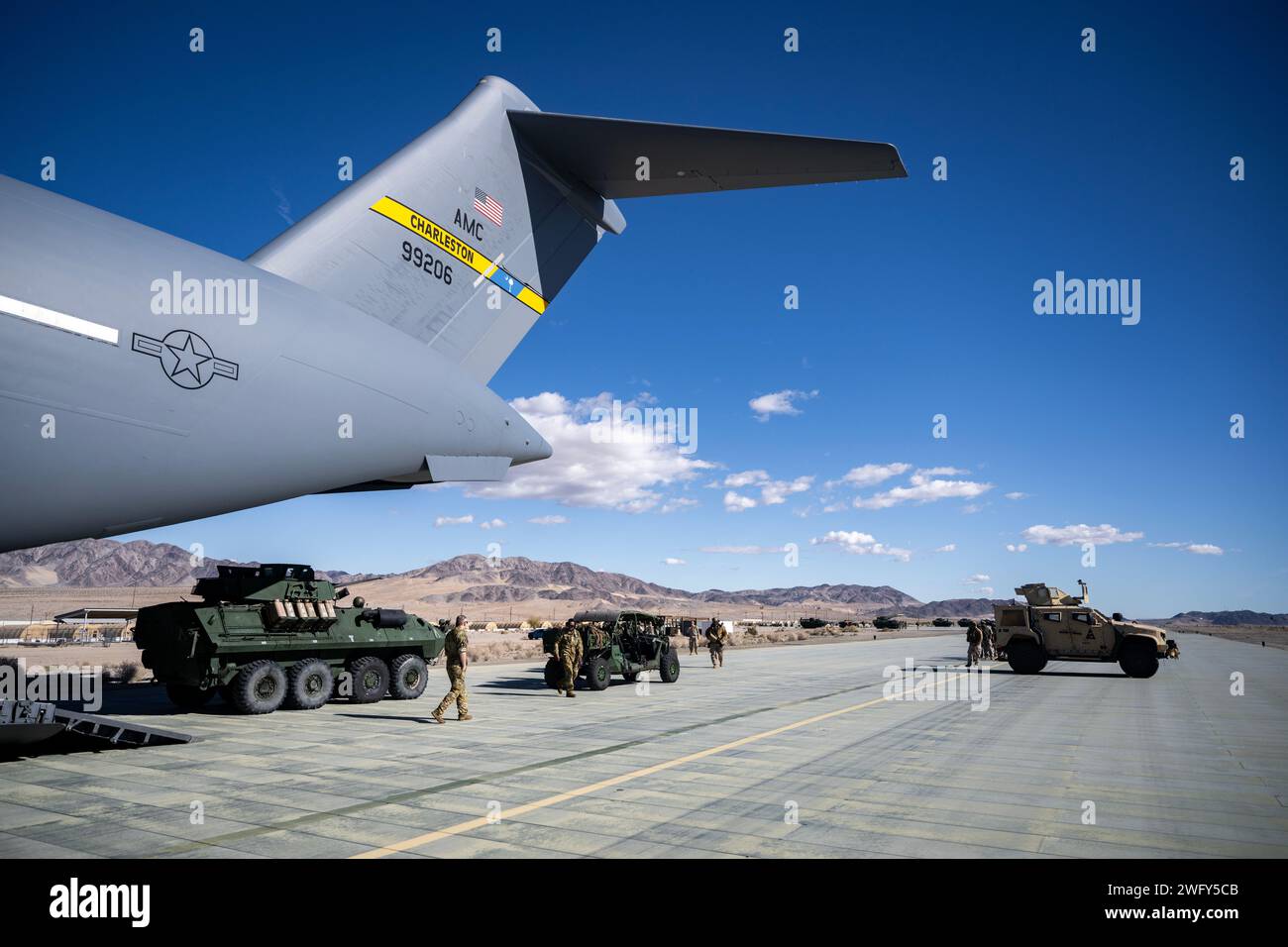 U.S. Air Force 14th Airlift Squadron, load vehicles and Marines ...
