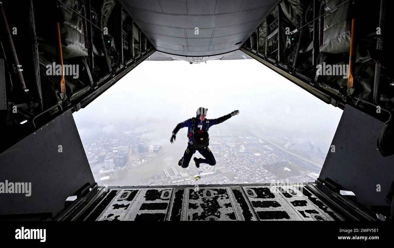 A U.S. Navy Parachute Team member jumps out of a C-130 aircraft in ...