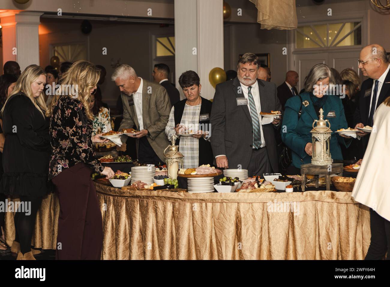 Event attendees plate food for themselves during the 2024 II Marine ...