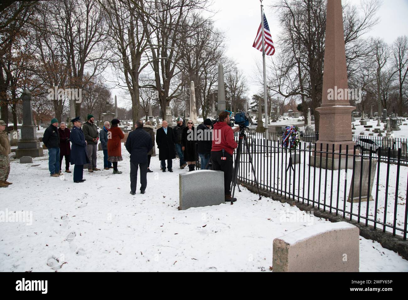Forest Lawn Cemetery staff, local media, and family members of Millard ...